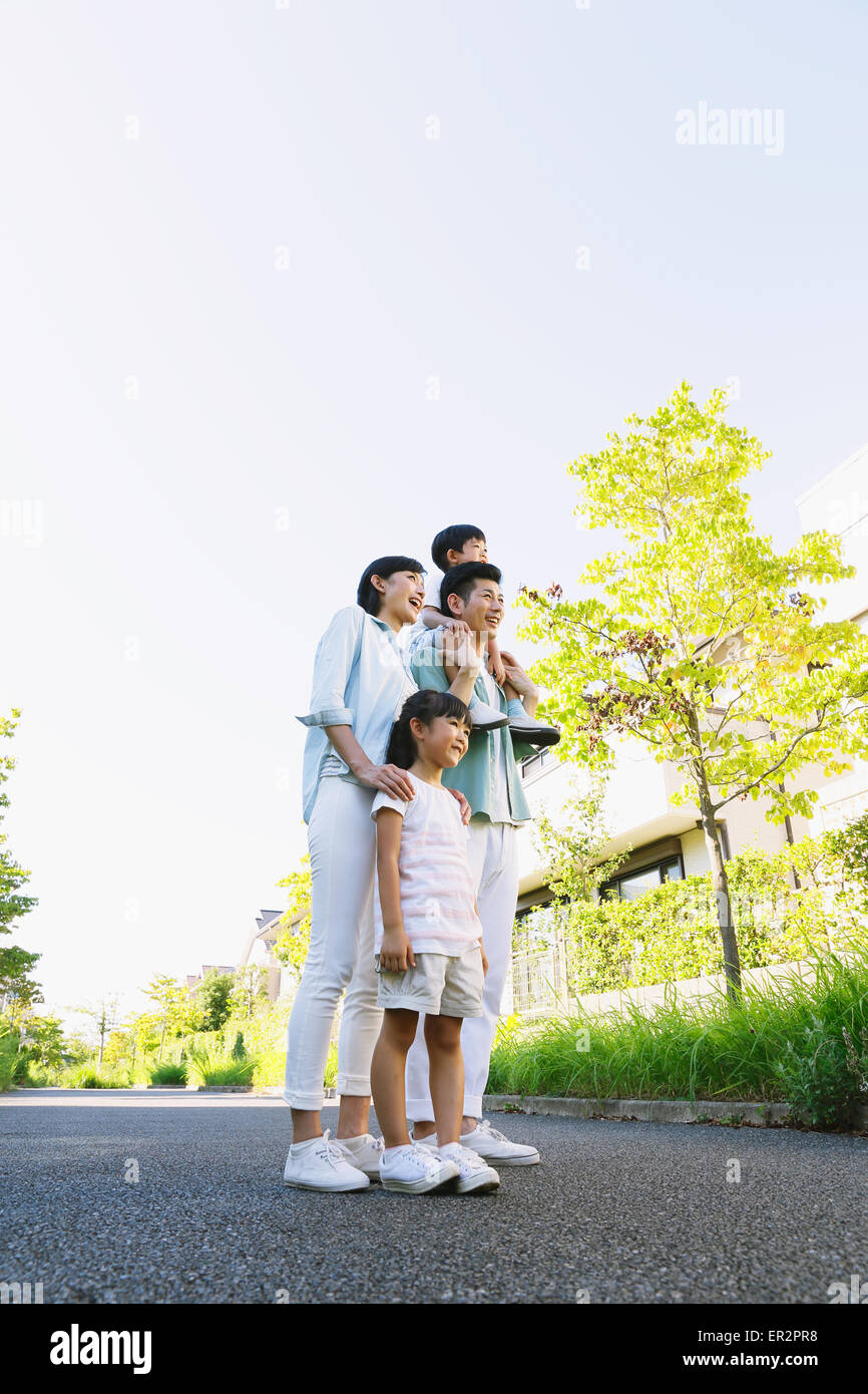 Happy Japanese family in a city park Stock Photo - Alamy
