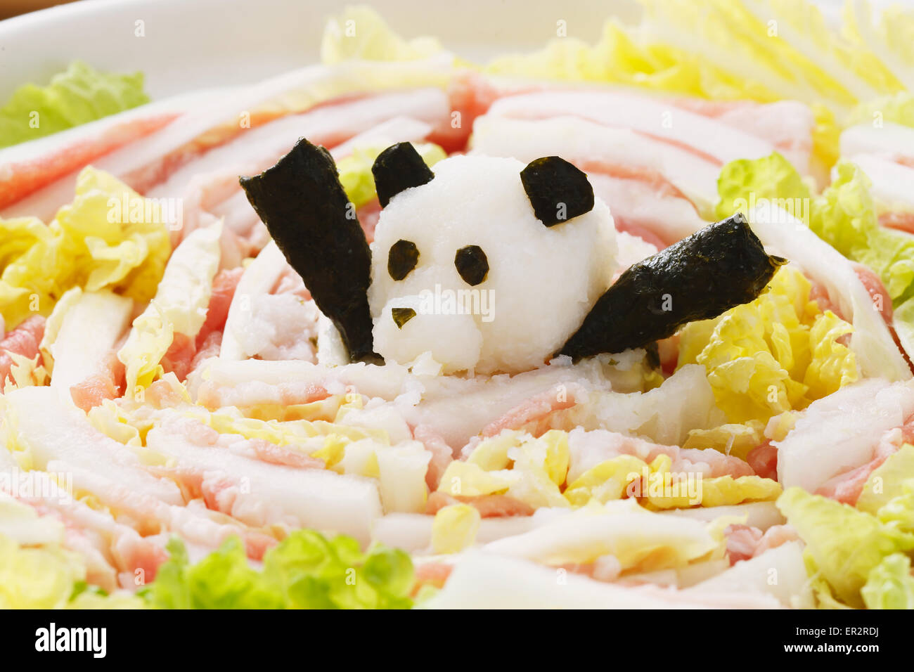 Japanese style casserole with grated radish animal decoration Stock ...