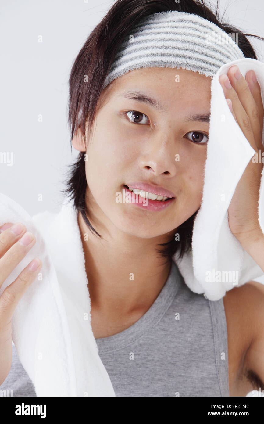 Man wiping face shirt hi-res stock photography and images - Alamy