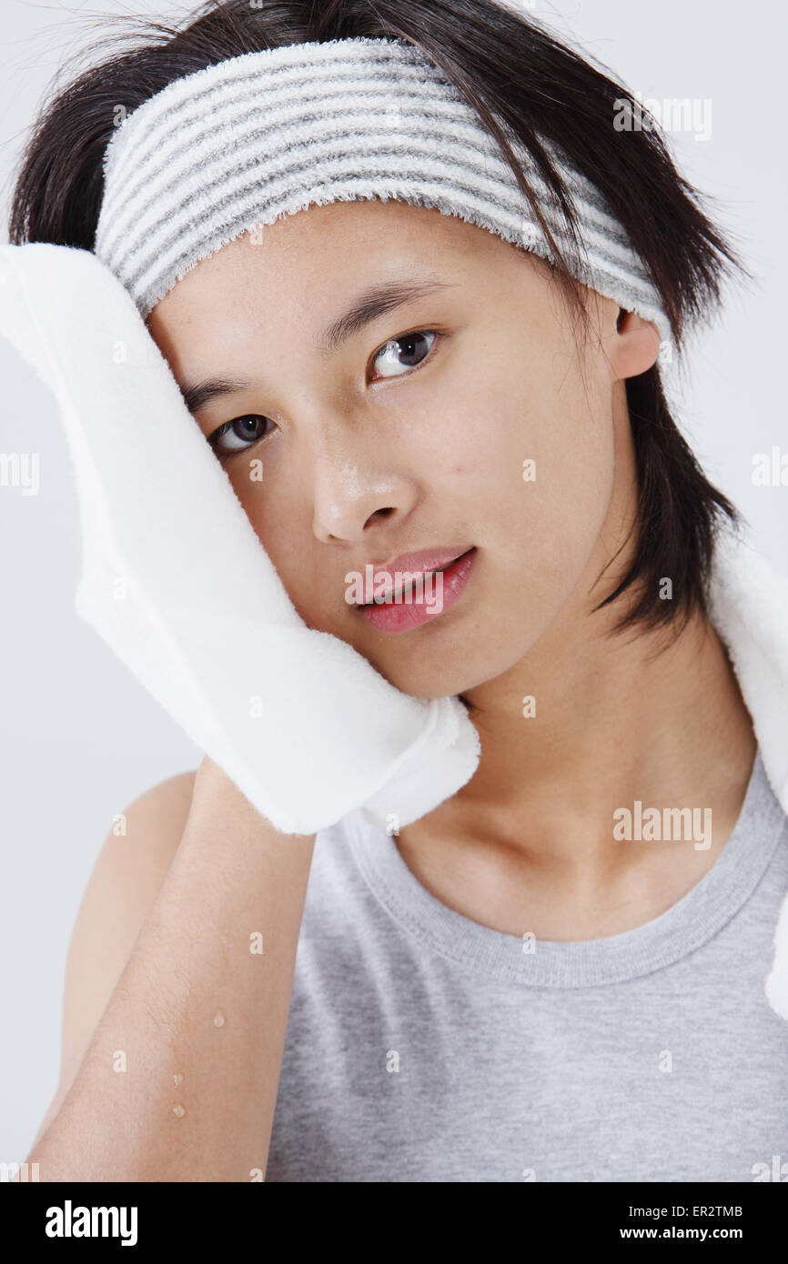 Man wiping face shirt hi-res stock photography and images - Alamy