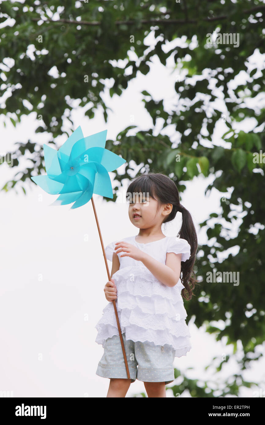 Young girl with pinwheel Stock Photo - Alamy
