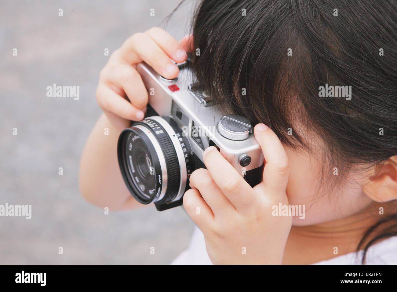 Young girl with camera Stock Photo - Alamy