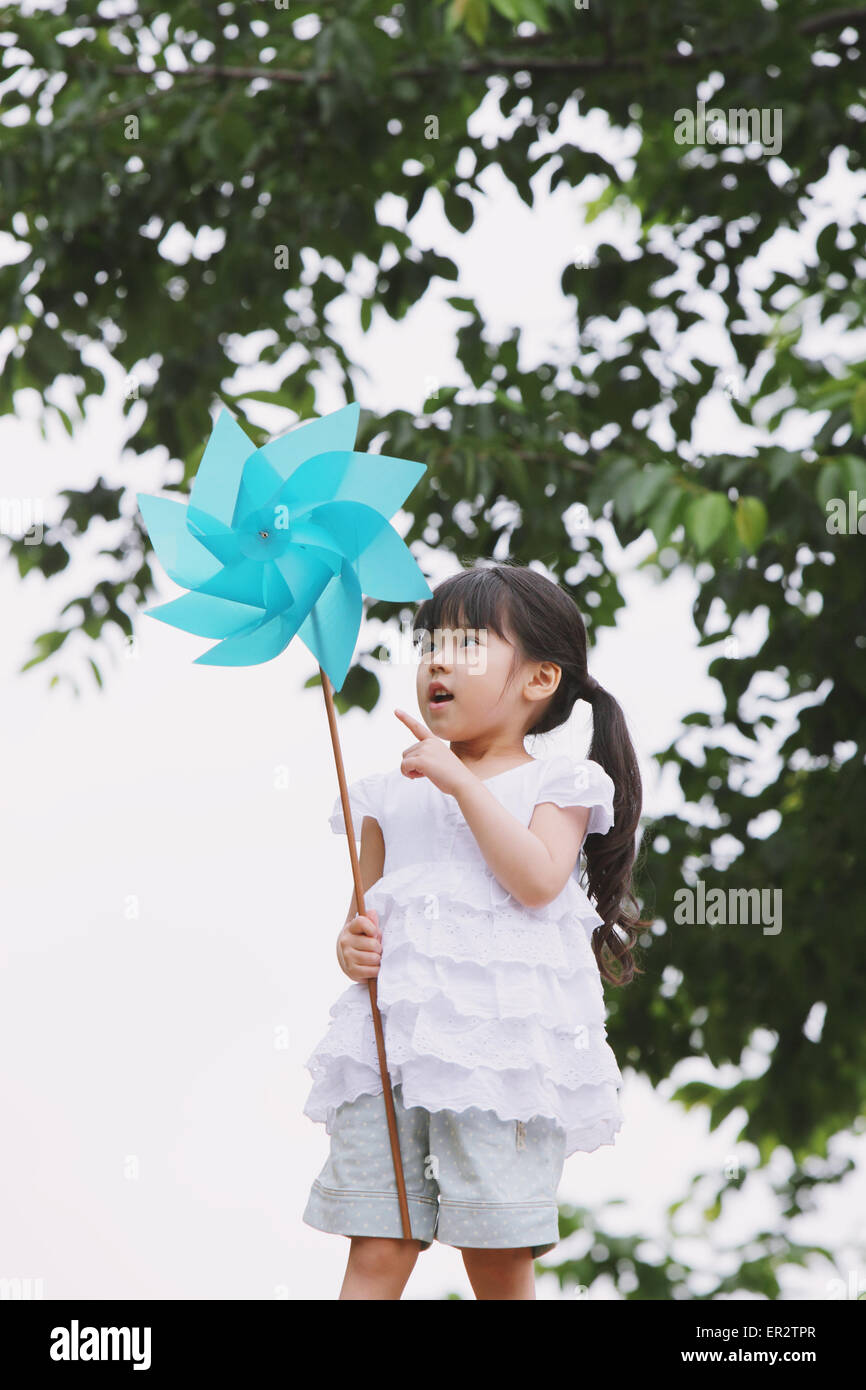Young girl with pinwheel Stock Photo - Alamy
