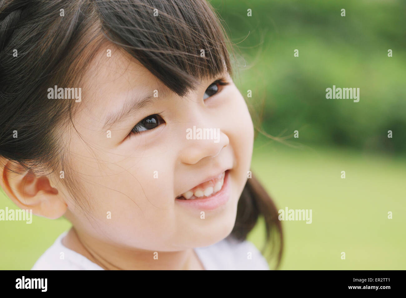 Young girl smiling away Stock Photo - Alamy