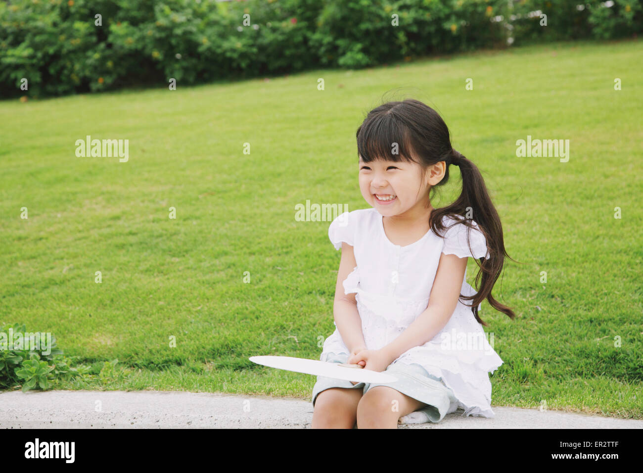 Young girl with paper fan Stock Photo - Alamy