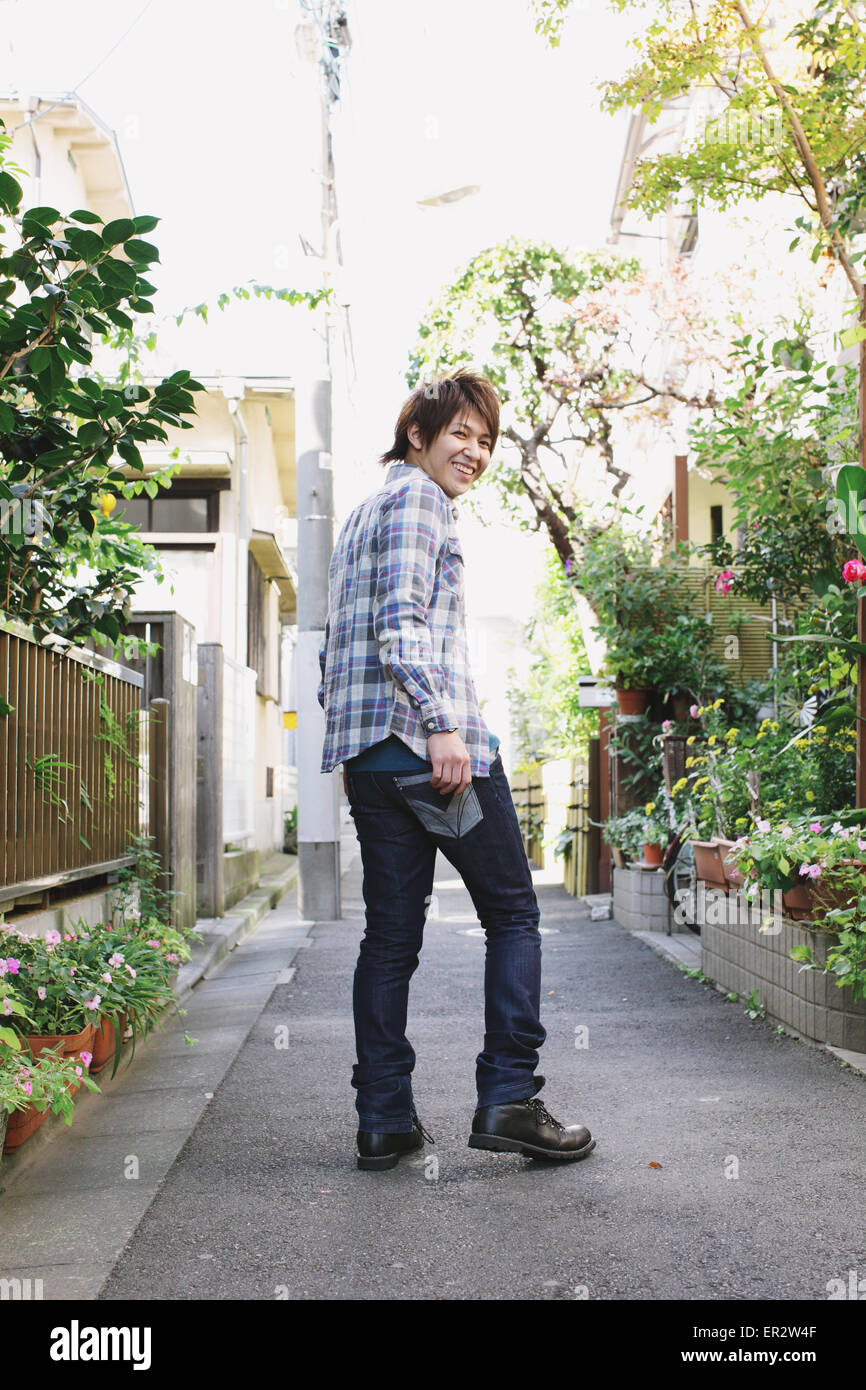 Handsome young man turning around hi-res stock photography and images ...