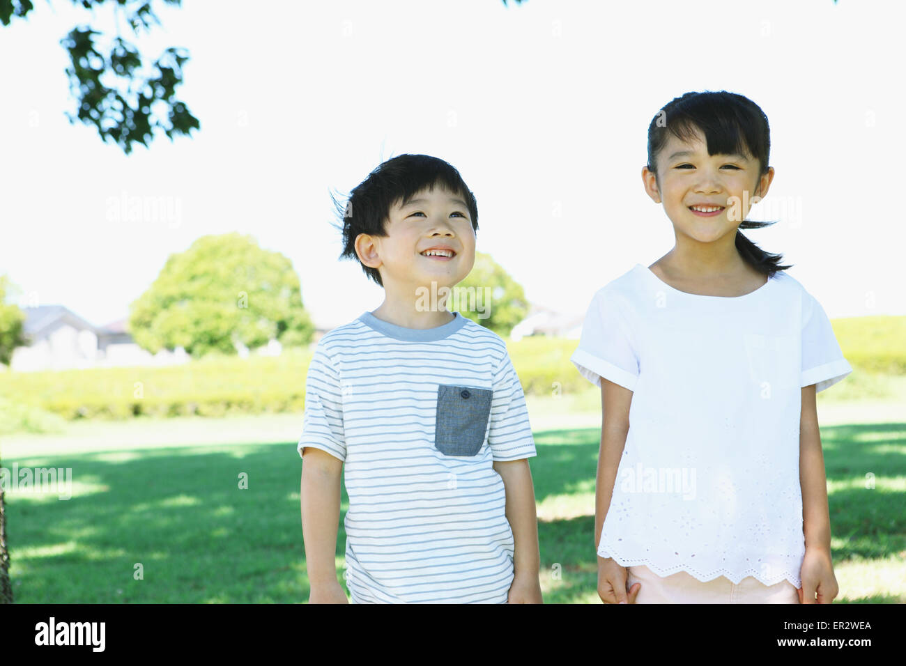 Happy Japanese kids in a city park Stock Photo - Alamy
