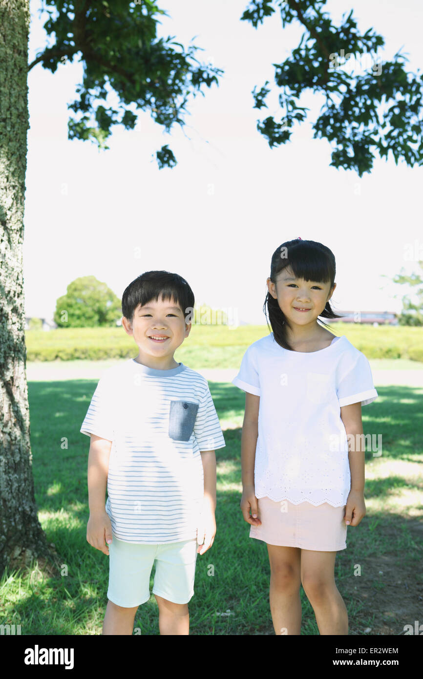 Happy Japanese kids in a city park Stock Photo - Alamy