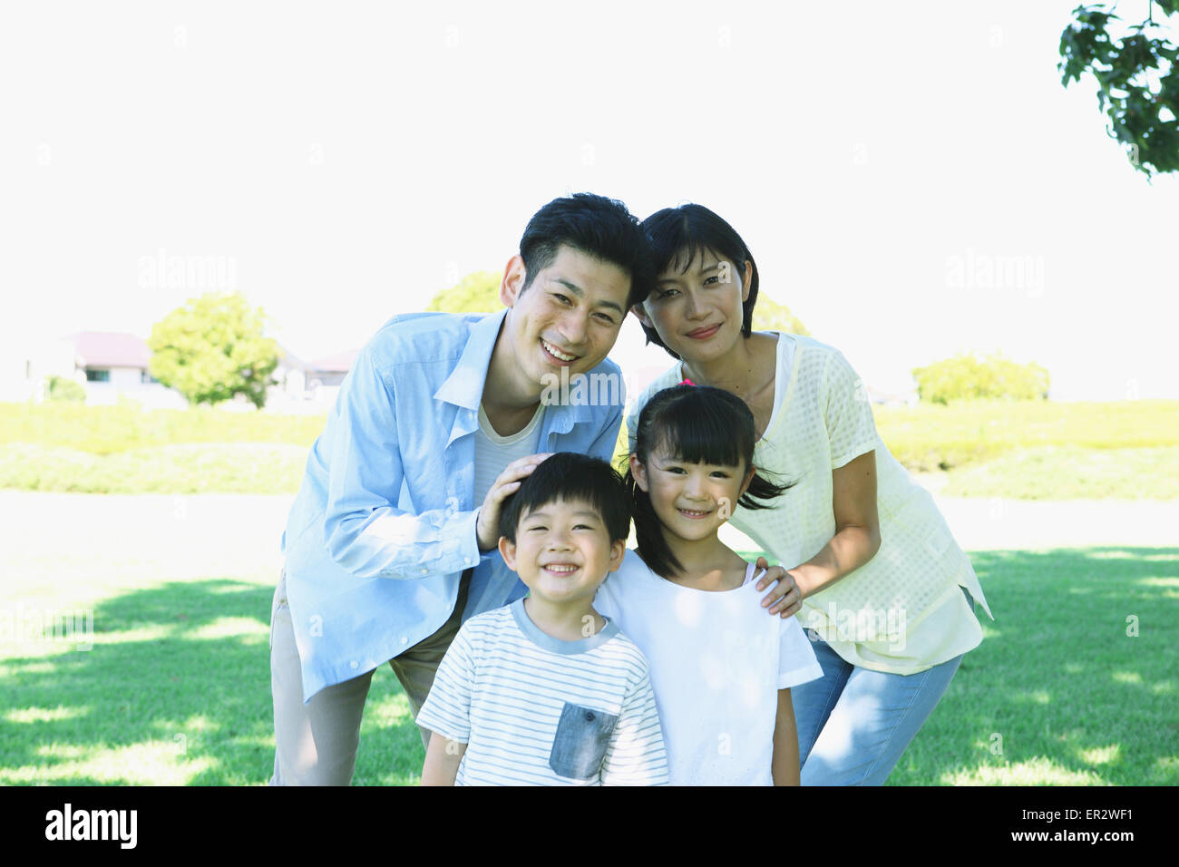 Happy Japanese family in a city park Stock Photo - Alamy