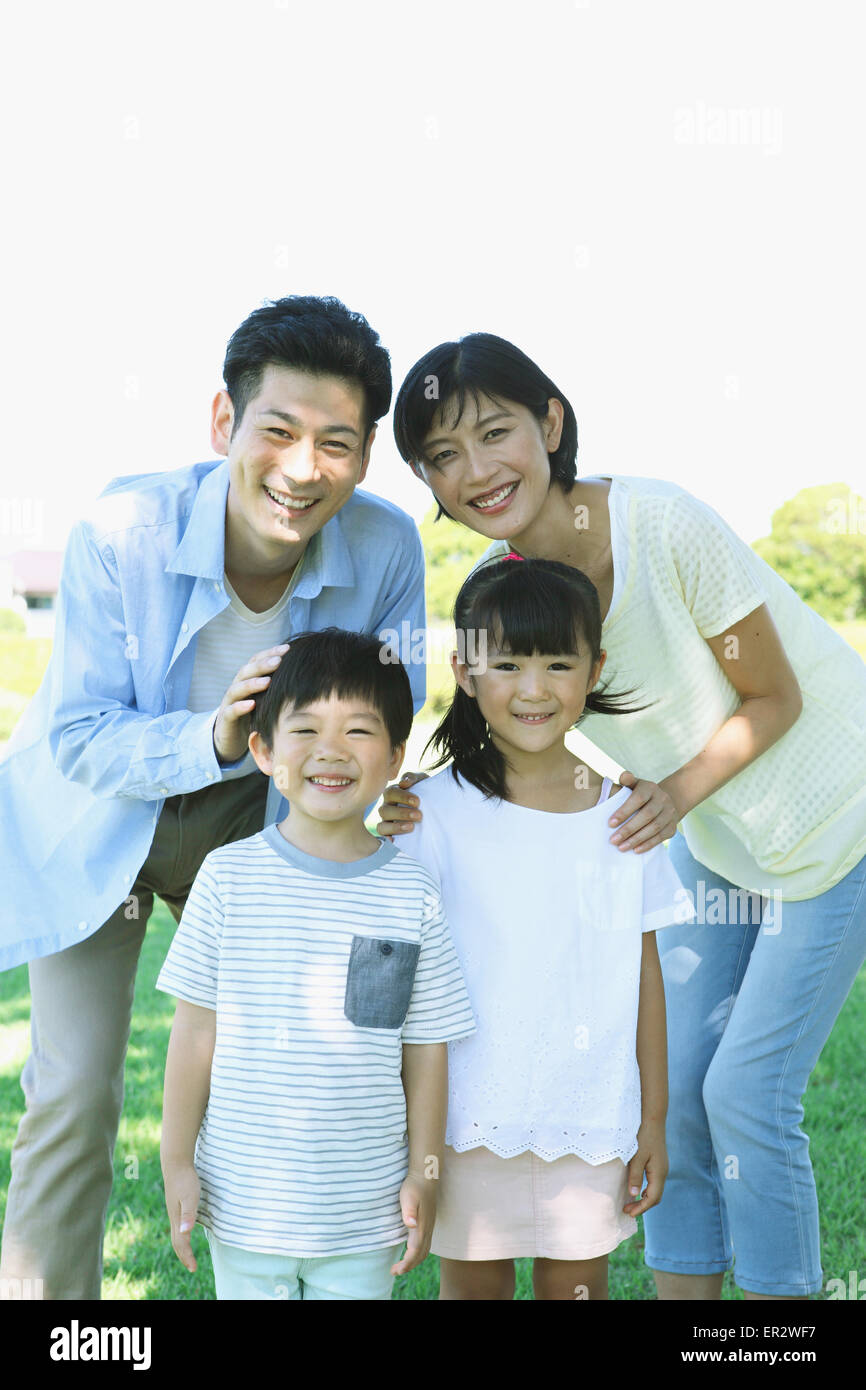 Happy Japanese family in a city park Stock Photo - Alamy