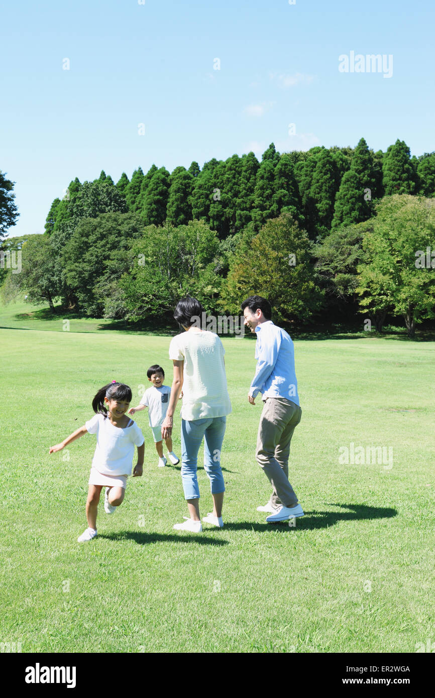 Happy Japanese family in a city park Stock Photo - Alamy