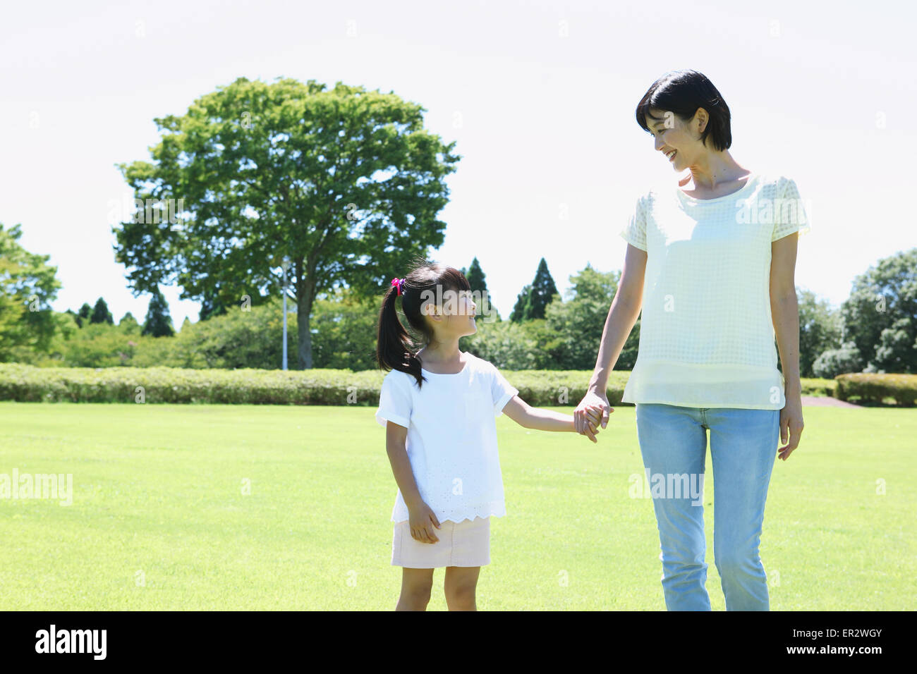 Japanese mother and daughter in a city park Stock Photo - Alamy