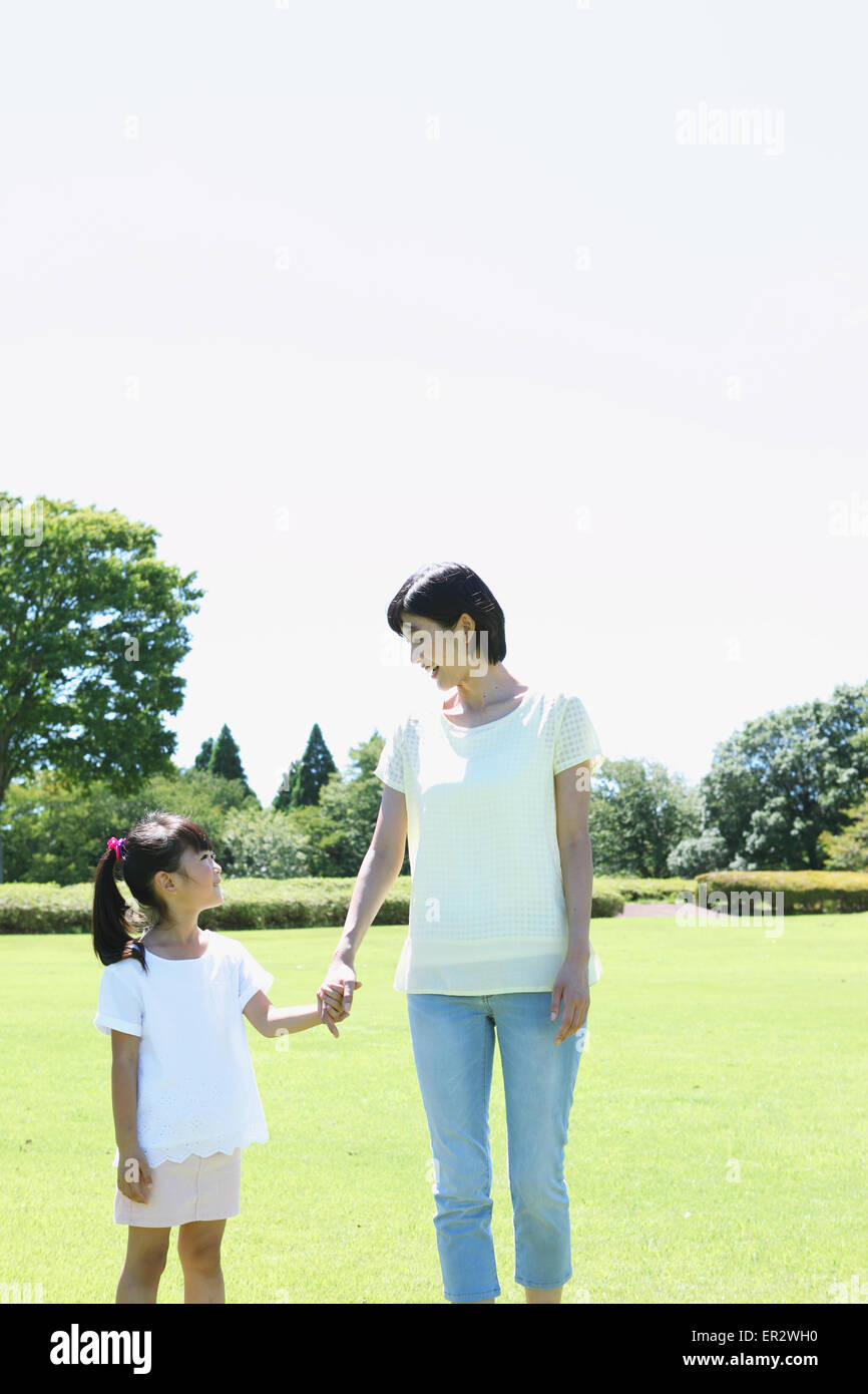 Japanese mother and daughter in a city park Stock Photo - Alamy