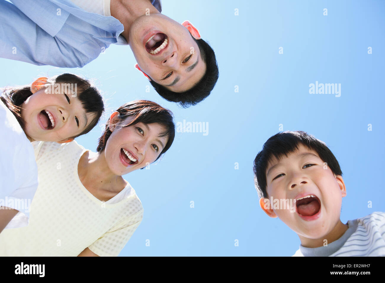 Happy family blue sky hi-res stock photography and images - Alamy