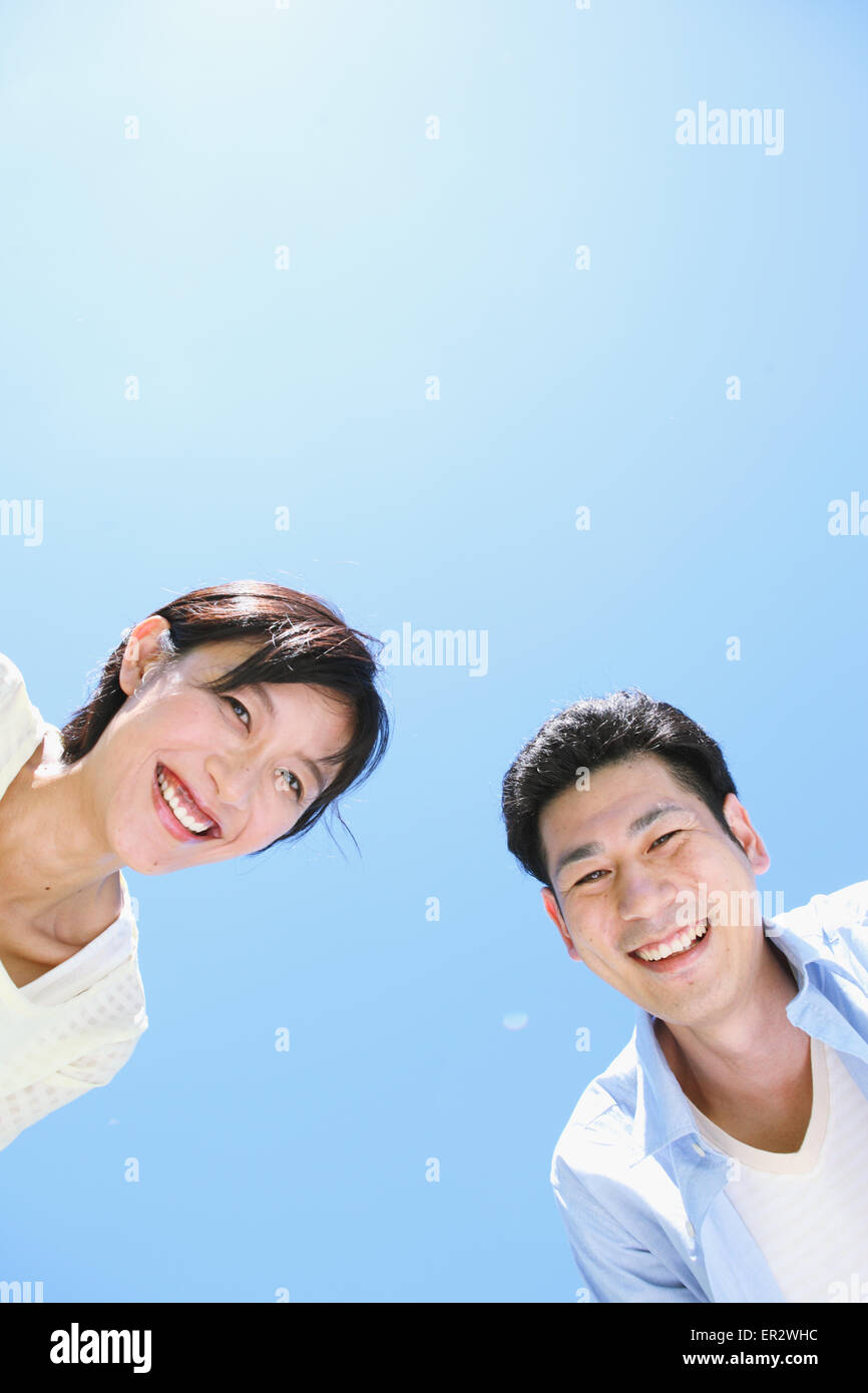 Happy Japanese couple smiling Stock Photo - Alamy