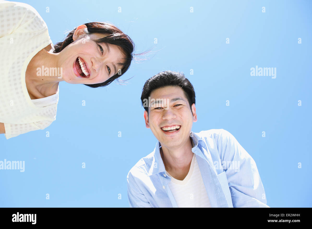 Happy Japanese couple smiling Stock Photo - Alamy