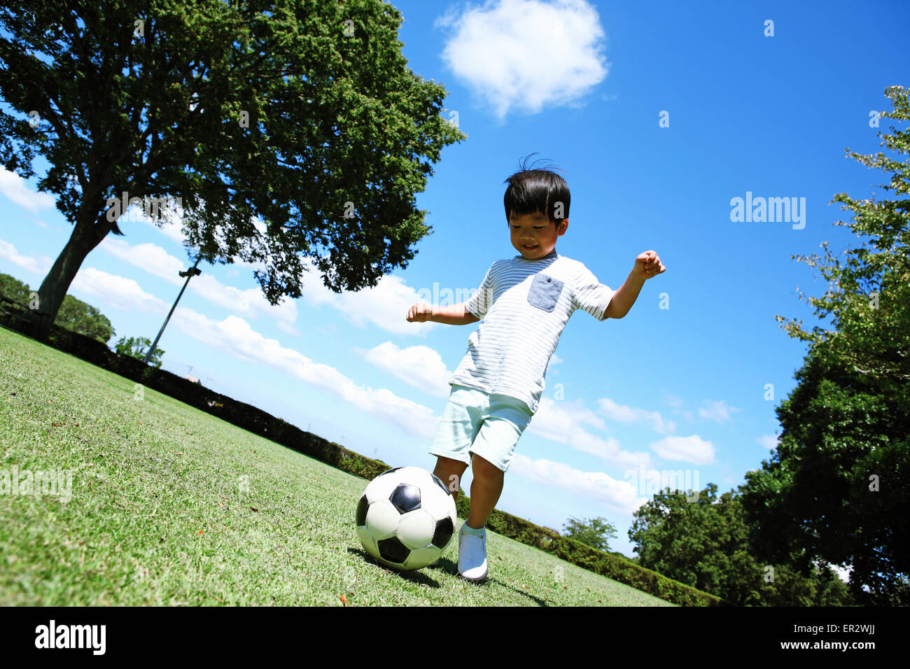 Little Boy Playing Outside