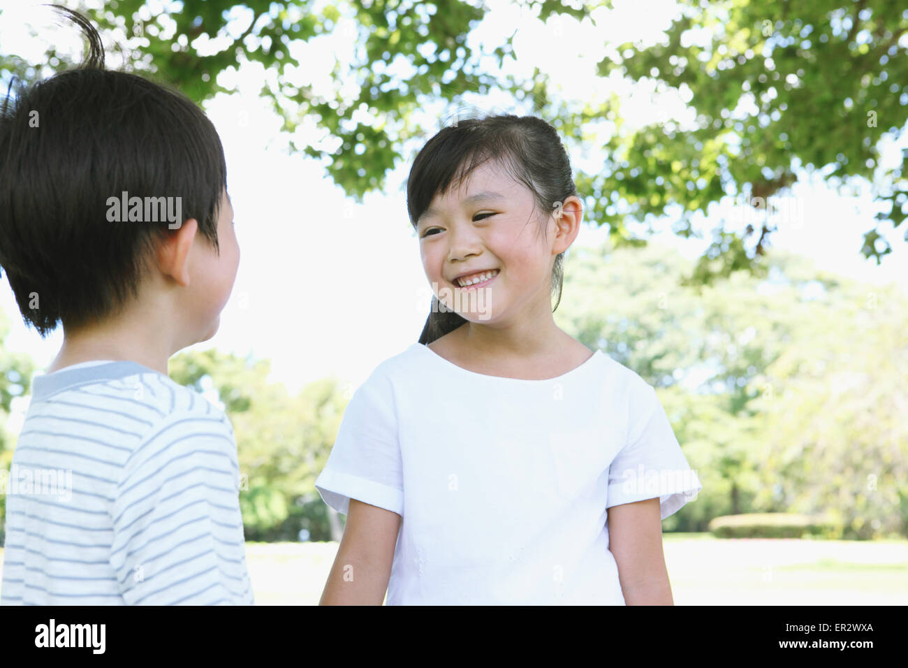 Happy Japanese kids in a city park Stock Photo - Alamy