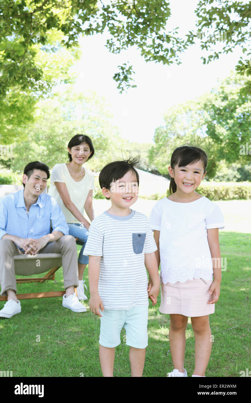 Happy Japanese family in a city park Stock Photo - Alamy