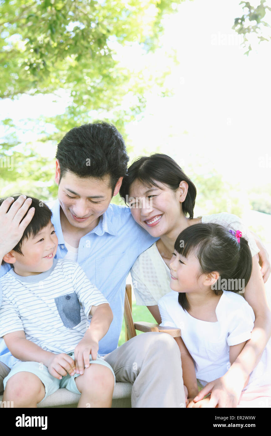 Happy Japanese family in a city park Stock Photo - Alamy