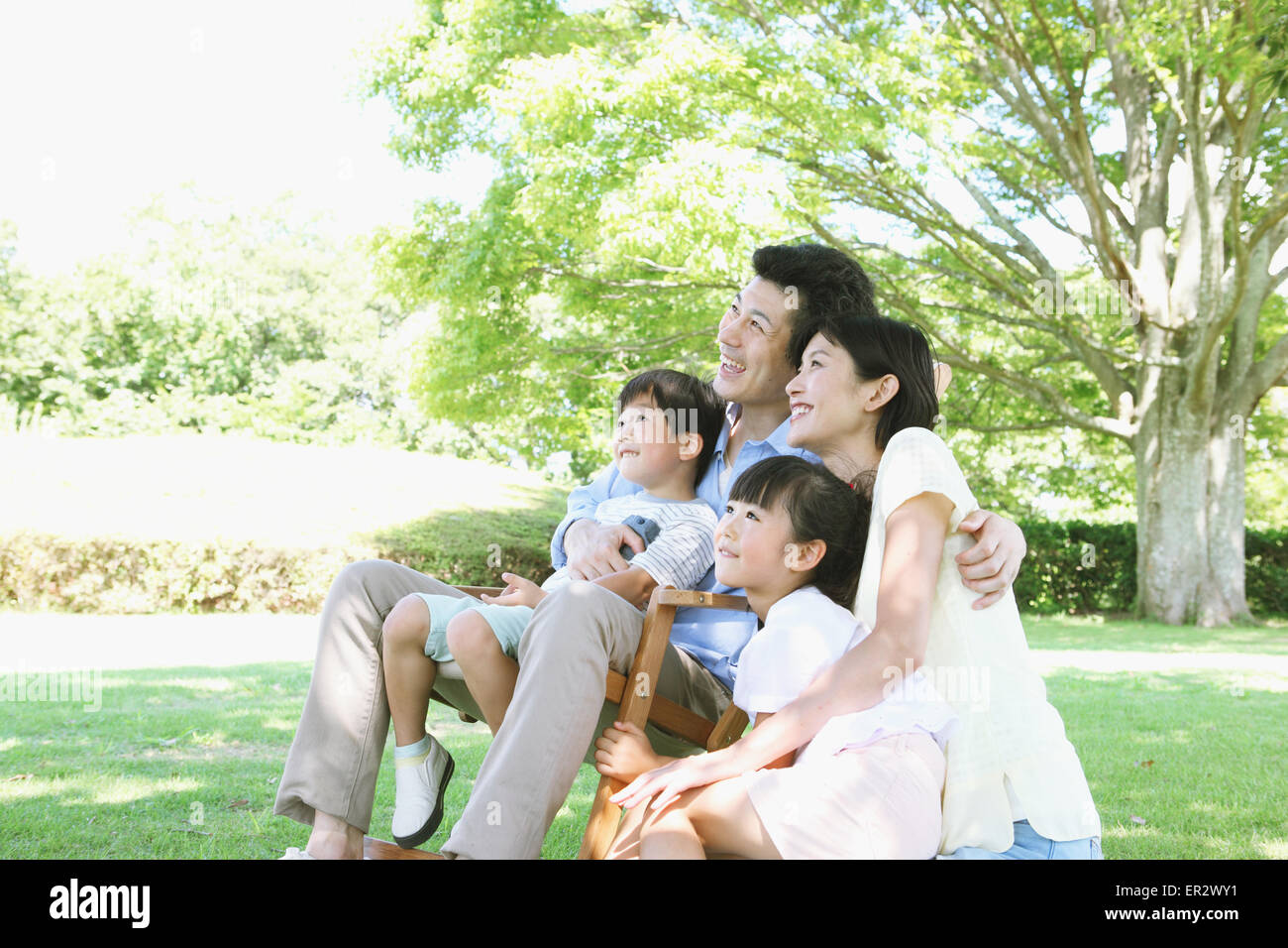 Happy Japanese family in a city park Stock Photo - Alamy