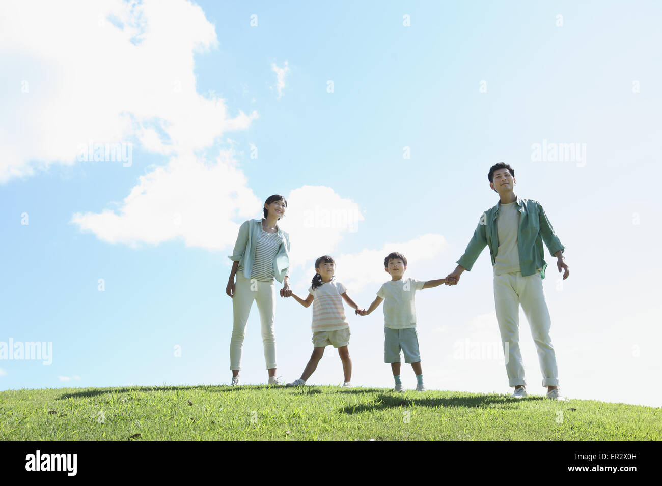 Happy Japanese family in a city park Stock Photo - Alamy