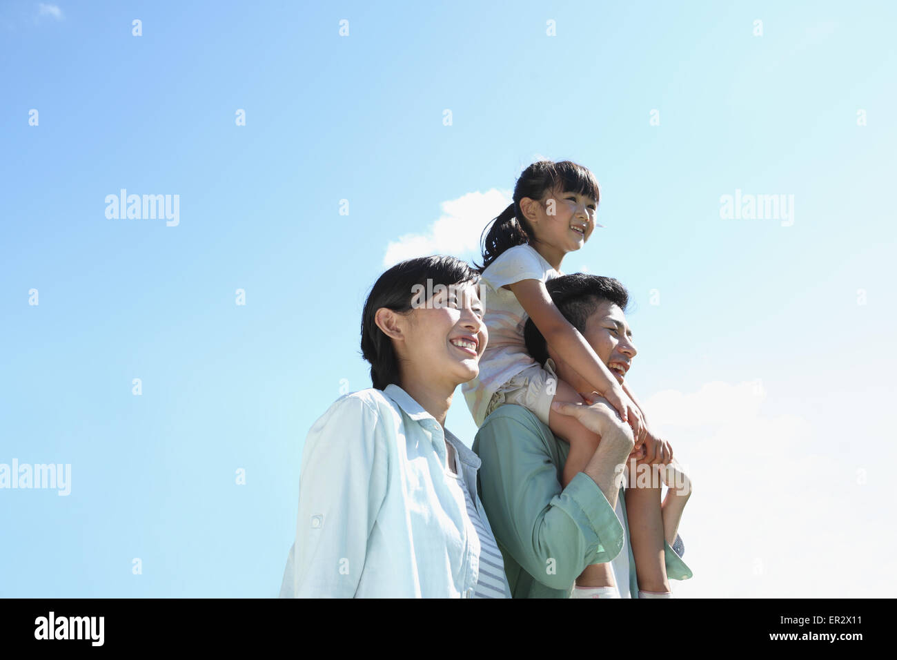 Happy Japanese family in a city park Stock Photo - Alamy