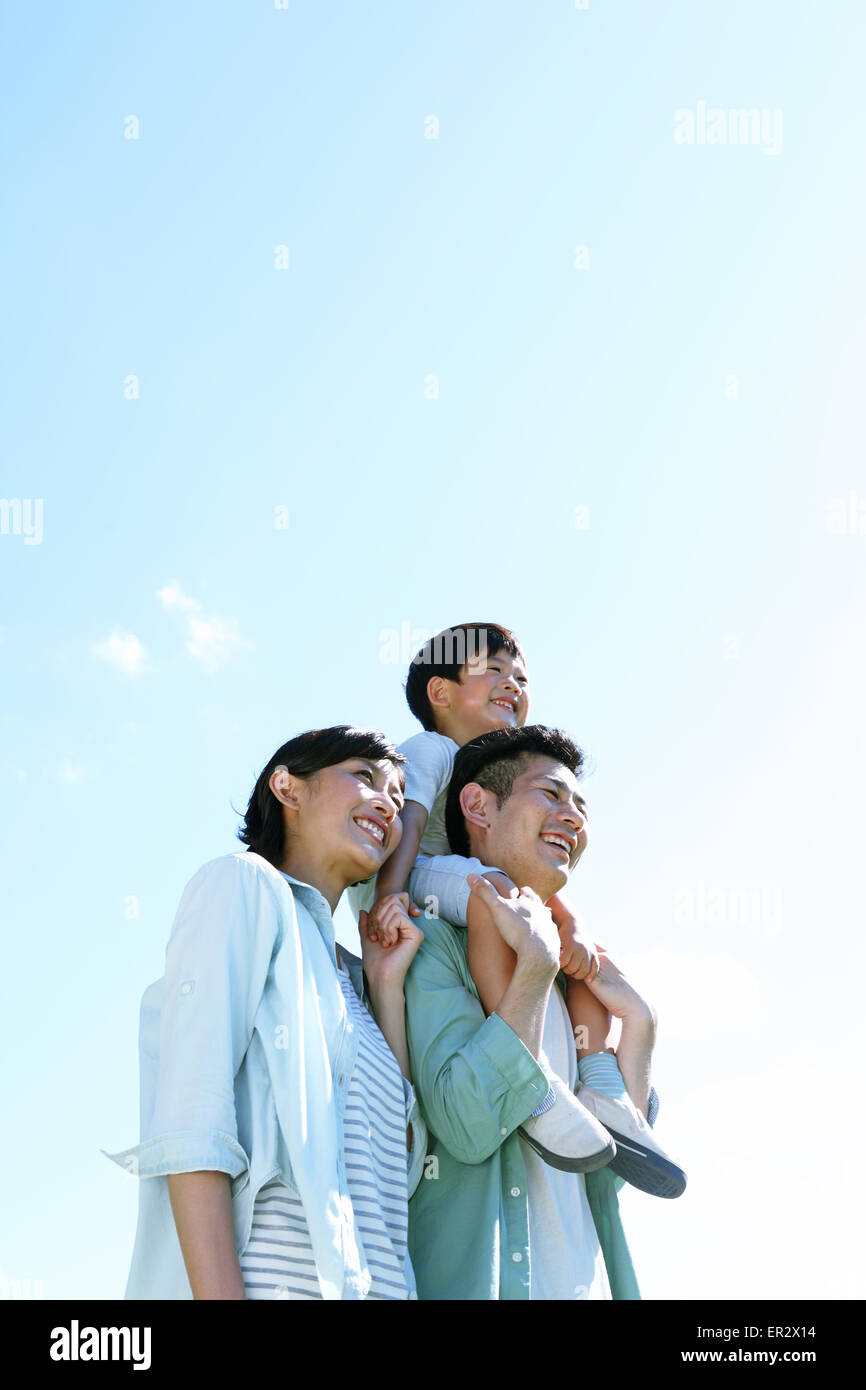 Happy Japanese family in a city park Stock Photo - Alamy