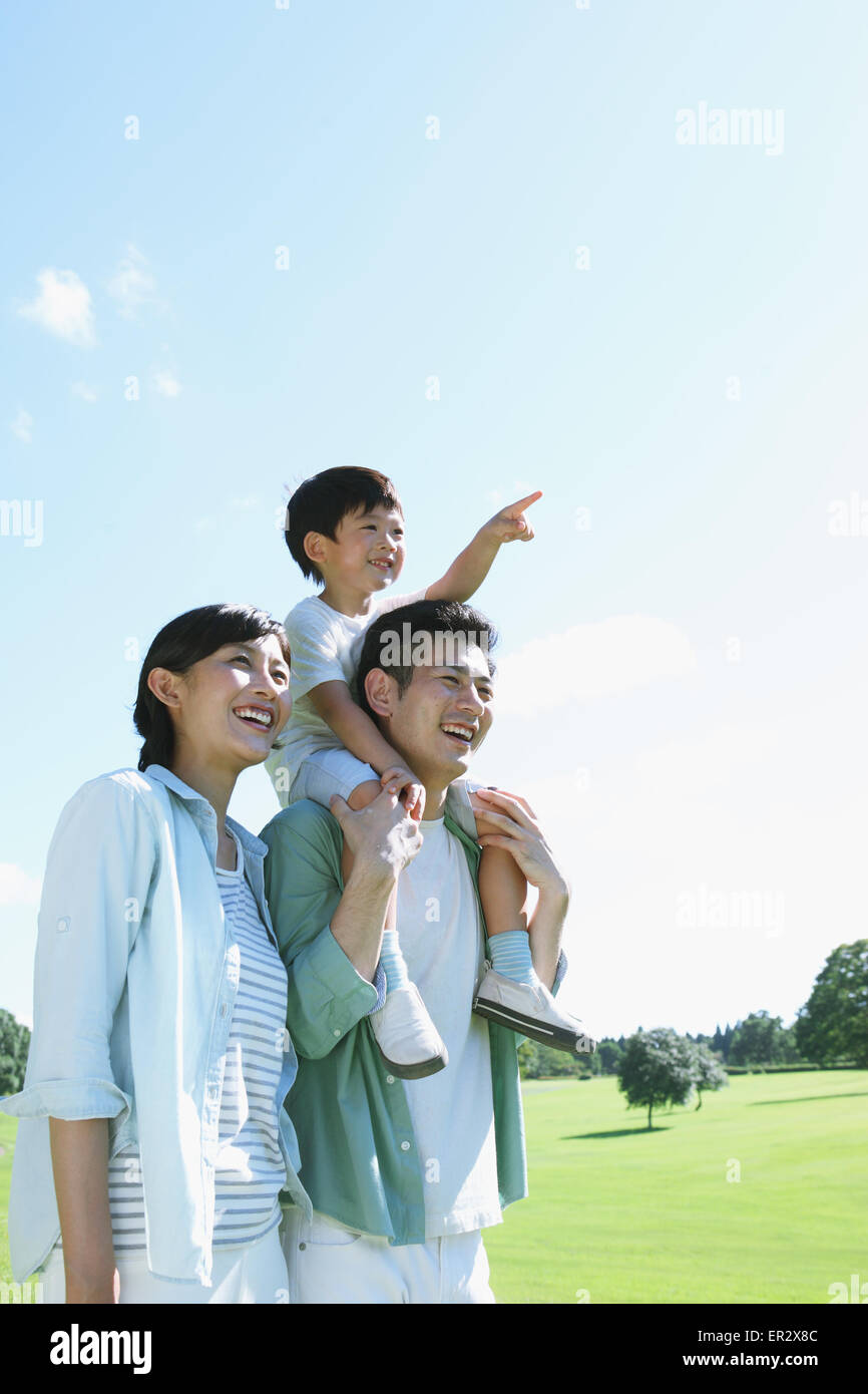 Happy Japanese family in a city park Stock Photo - Alamy