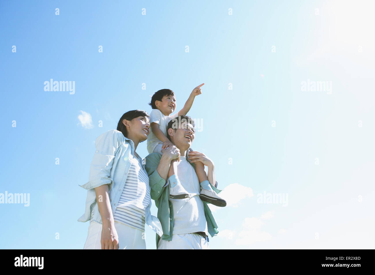 Happy Japanese family in a city park Stock Photo - Alamy