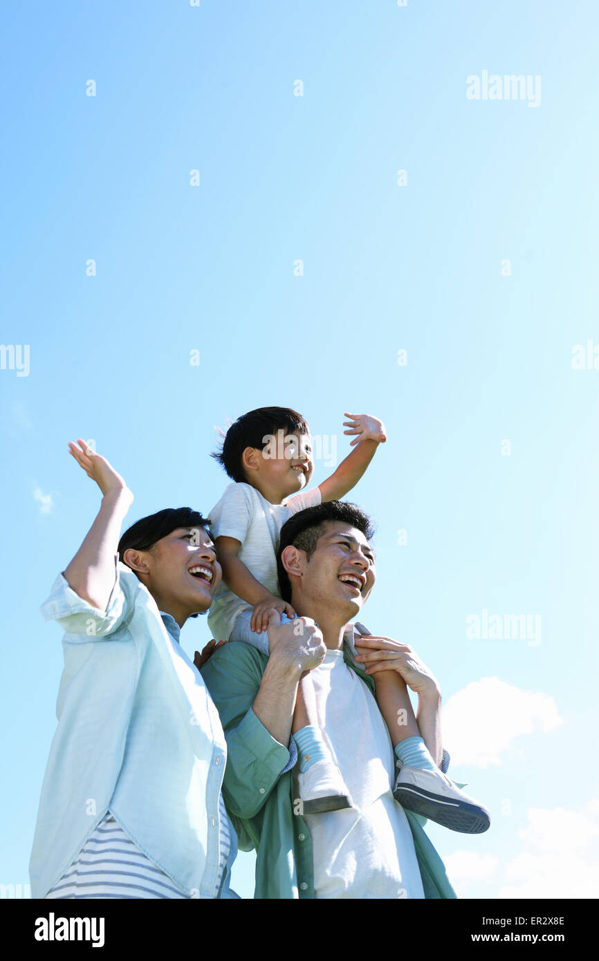 Happy Japanese family in a city park Stock Photo - Alamy