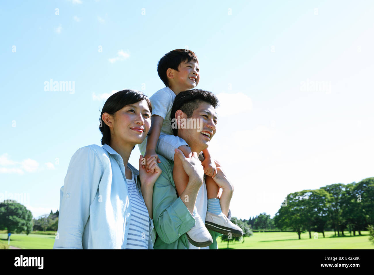 Happy Japanese family in a city park Stock Photo - Alamy