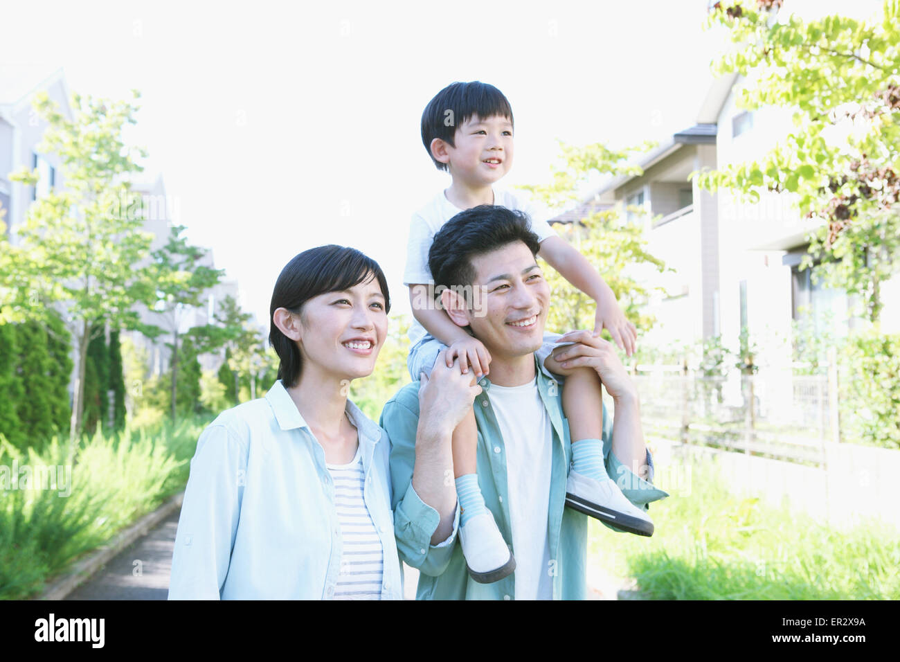 Happy Japanese family in a city park Stock Photo - Alamy