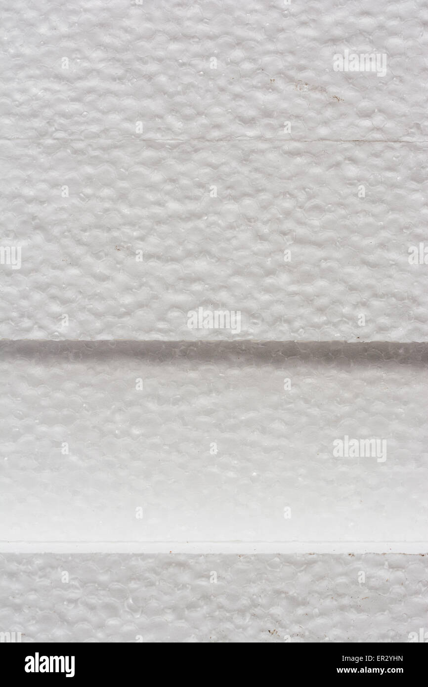Polystyrene insulation boards background with copyspace, vertical side ...