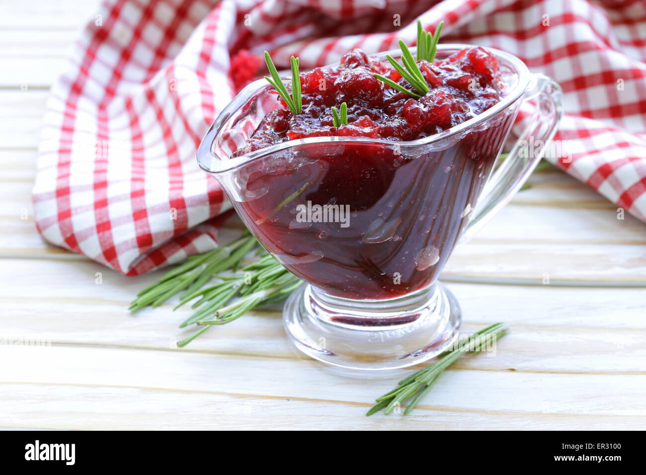 Traditional cranberry sauce with rosemary in a gravy boat Stock Photo ...