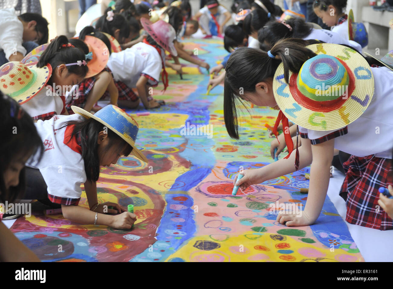 Beijing, China. 26th May, 2015. Children paint during an painting ...