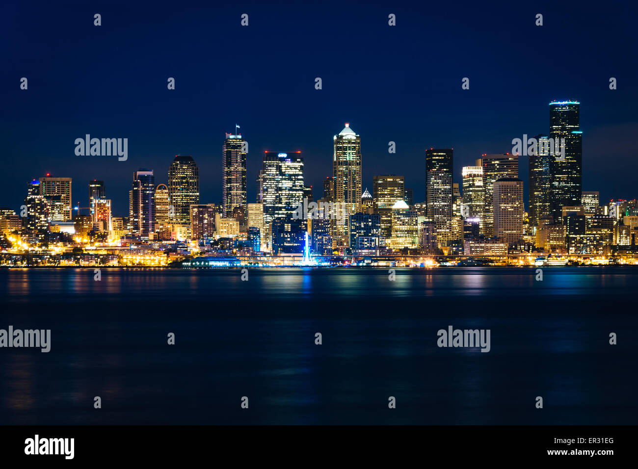 The Seattle skyline and Elliott Bay at night, seen from West Seattle ...