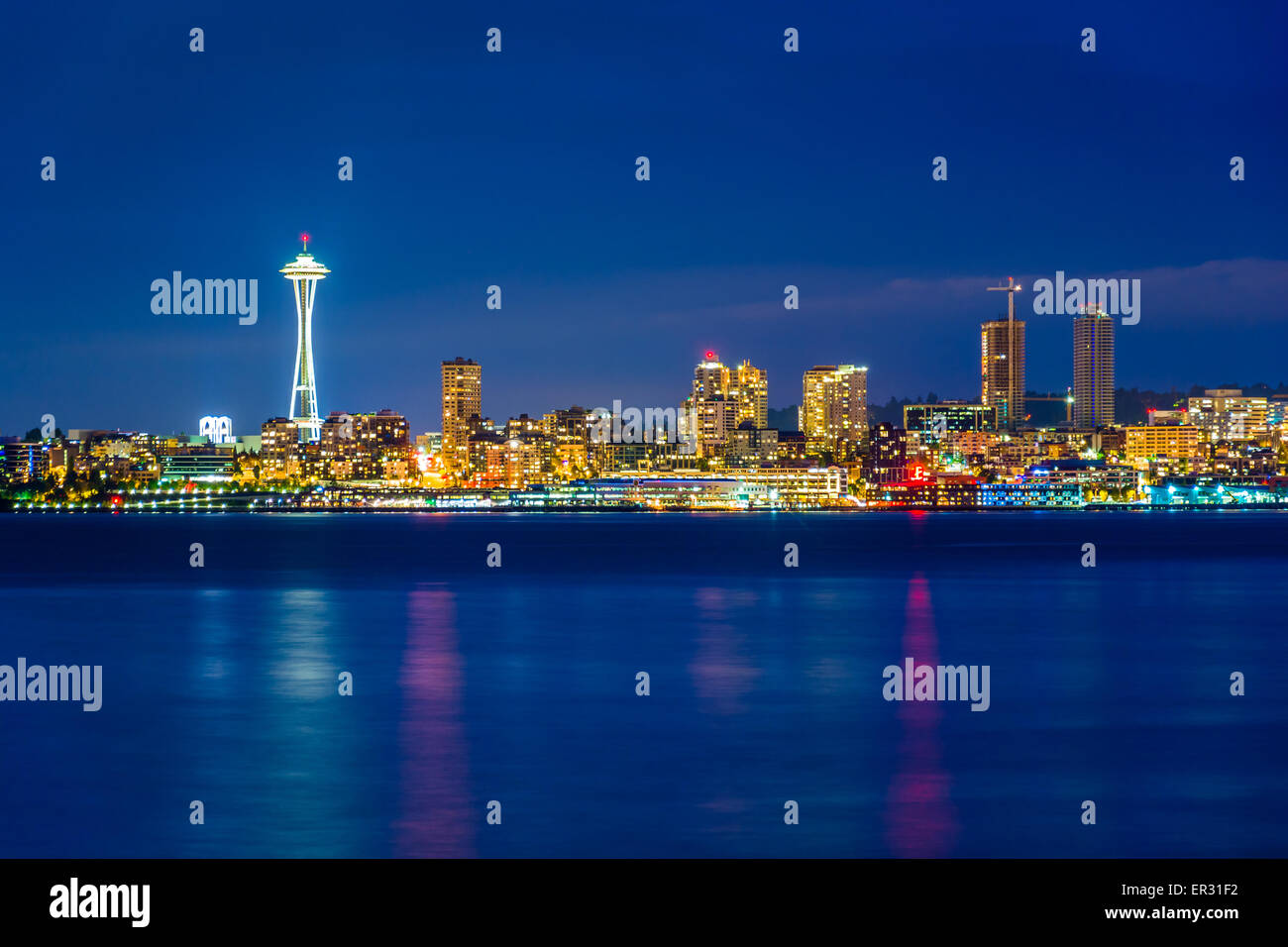 The Seattle skyline and Elliott Bay at night, seen from West Seattle ...