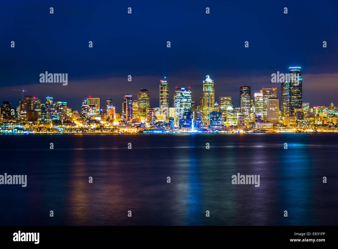 The Seattle skyline and Elliott Bay at night, seen from West Seattle ...