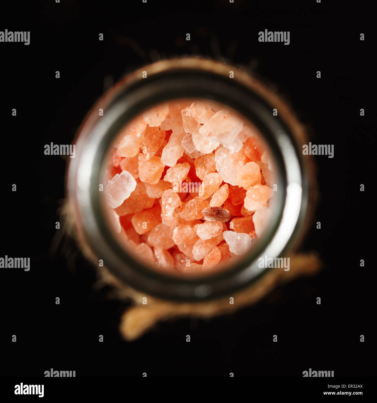 Top view of Close up of Himalayan Pink Salt Crystals in a Glass Bottle ...