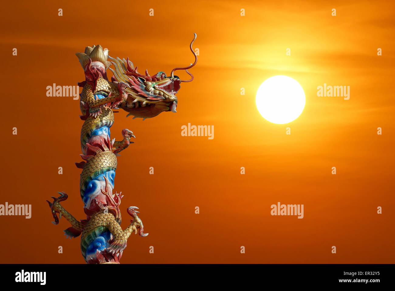 Chinese dragon with beautiful sunset background Stock Photo - Alamy