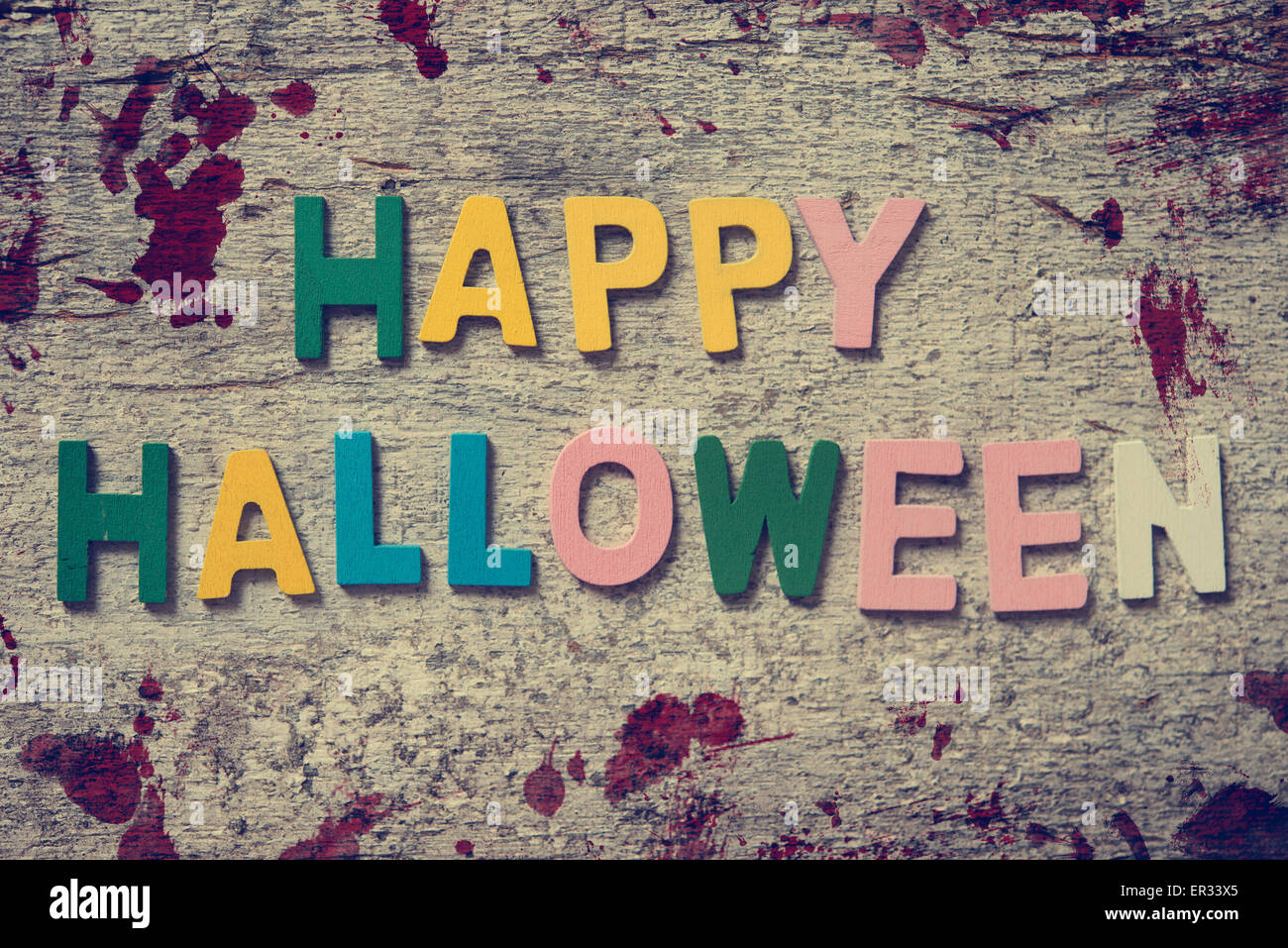 The colorful words "HAPPY HALLOWEEN" made with wooden letters on old ...