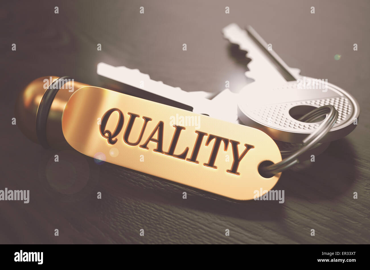Keys to Quality. Concept on Golden Keychain Stock Photo - Alamy
