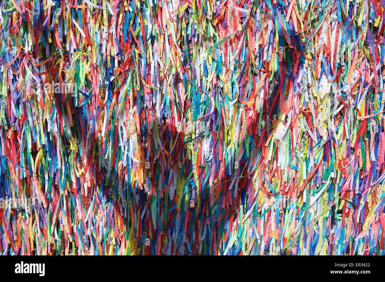 Shadow of person raising arms in celebration in front of a colorful ...