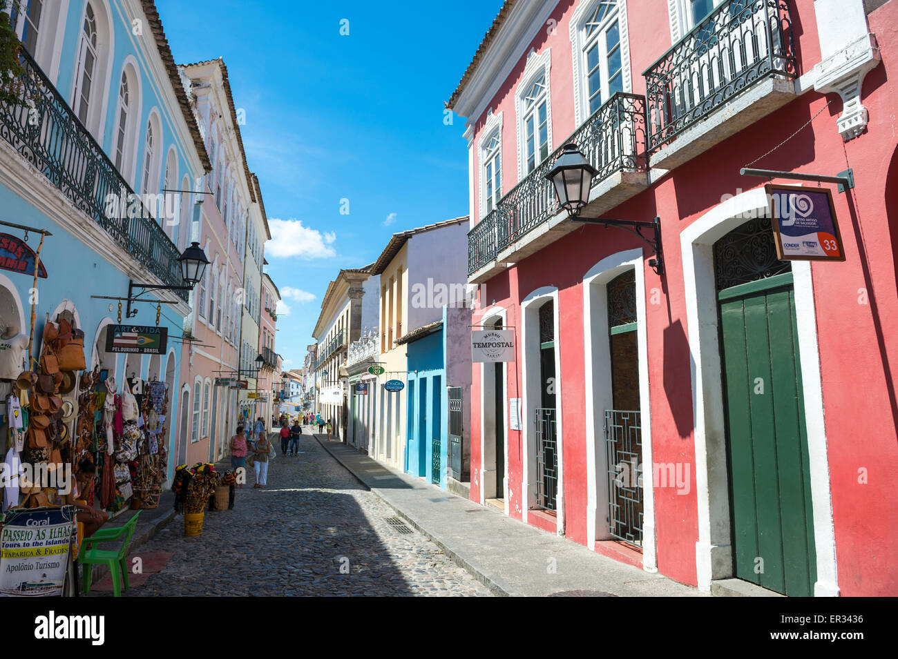 SALVADOR, BRAZIL - MARCH 12, 2015: Daily life along cobblestone street ...