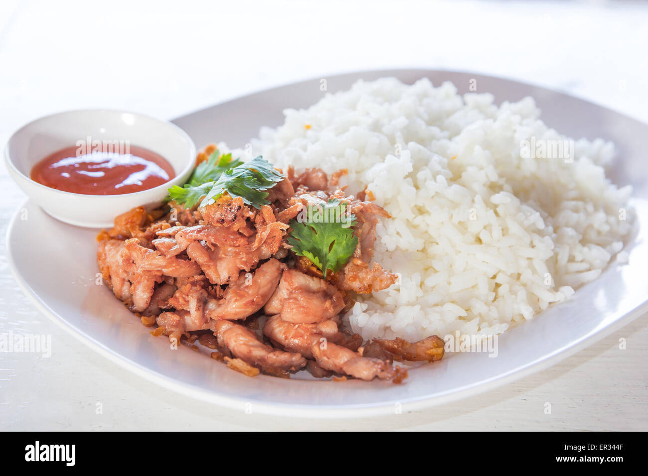 Simple Thai food made from rice and chicken fried Stock Photo - Alamy