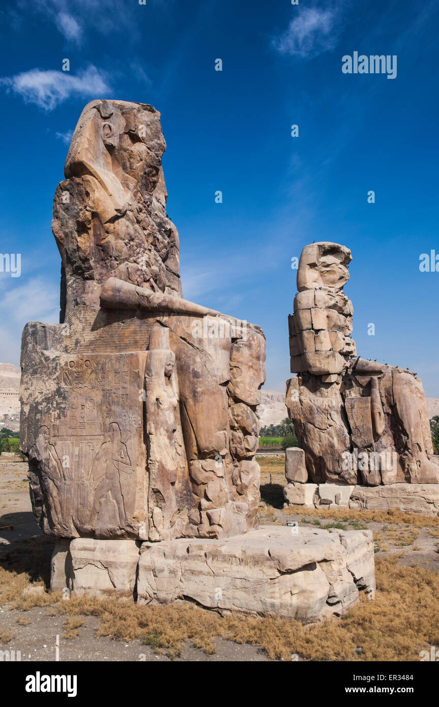 Colossi of Memnon statues in Luxor, Egypt Stock Photo - Alamy