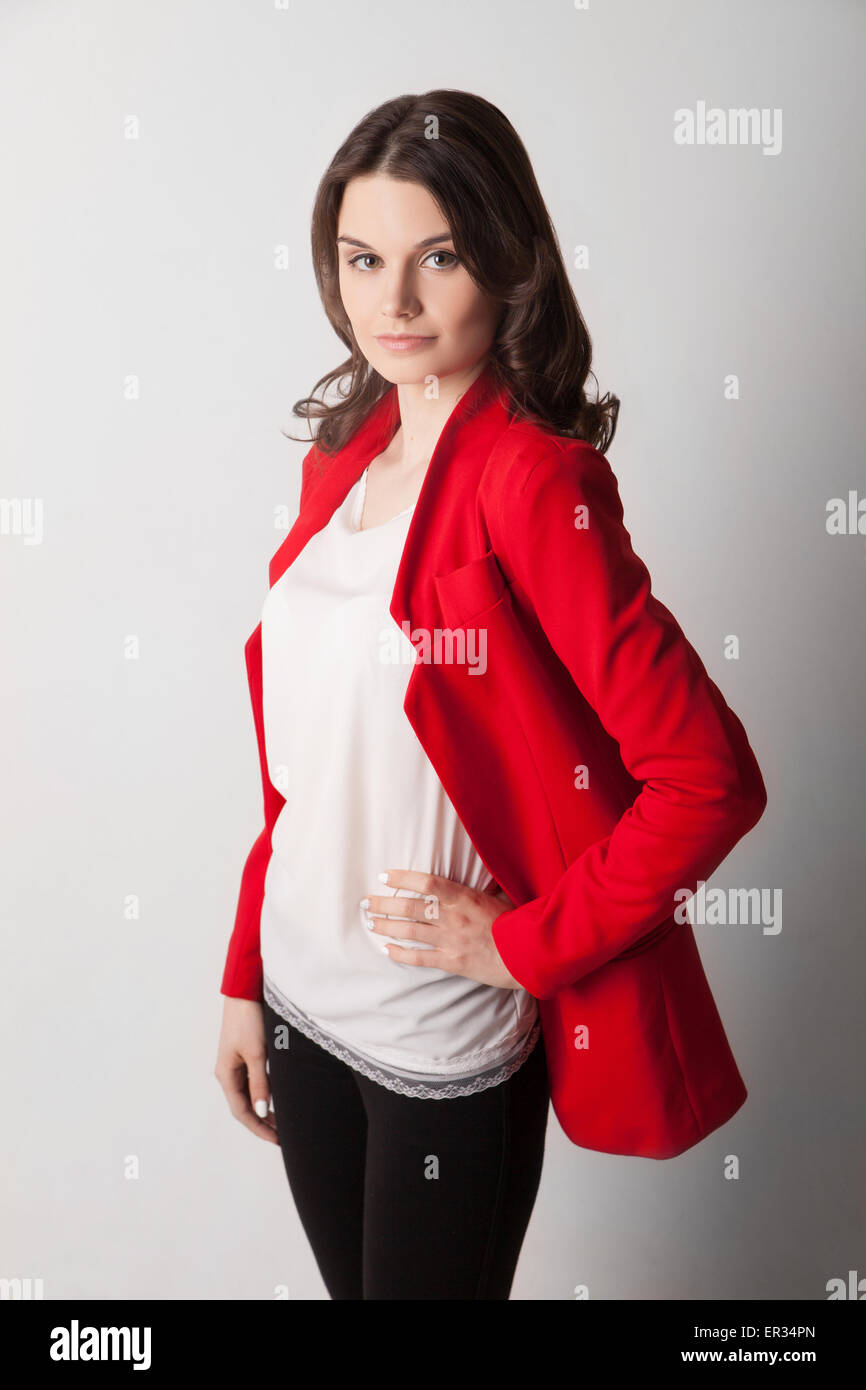 Young beautiful woman in red jacket Stock Photo - Alamy