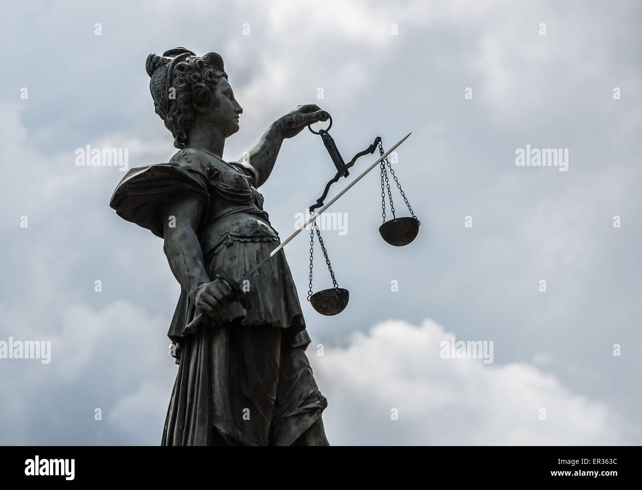 The statue of Justitia, the Roman goddess of justice, stands with a ...