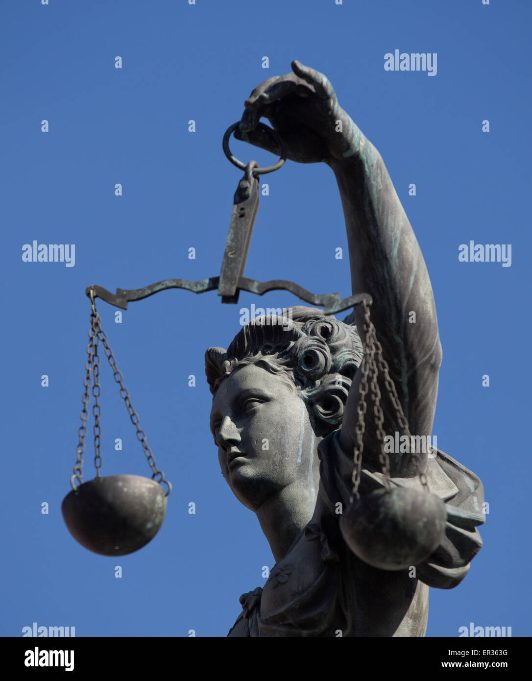 The statue of Justitia, the Roman goddess of justice, stands with a ...